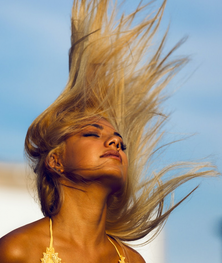 10 Best Ways to Protect Your Hair From the Sun, According to Experts